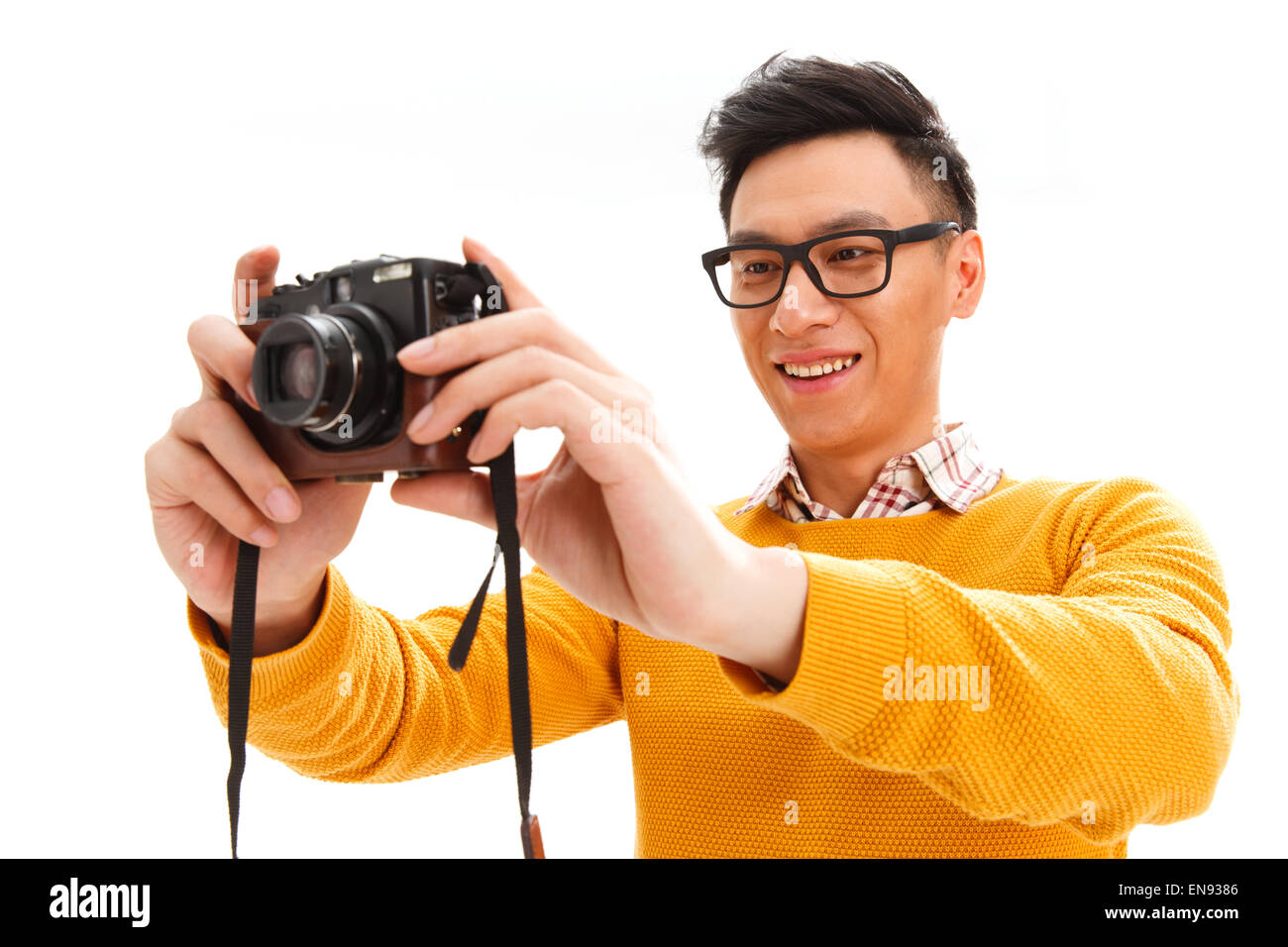 Young guy holding a camera Stock Photo - Alamy