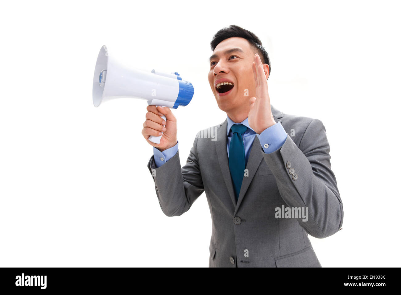The young man took the microphone to shout Stock Photo - Alamy