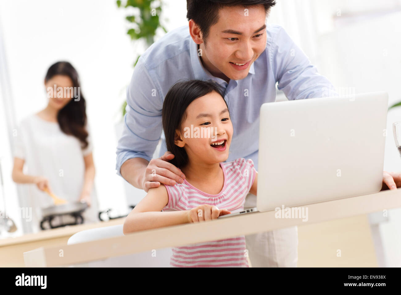 Family at home Stock Photo - Alamy