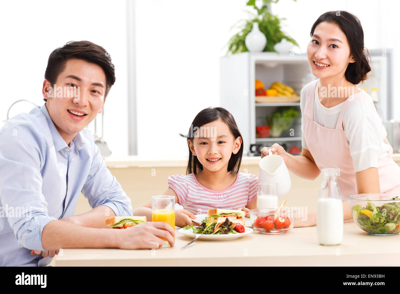 Family having breakfast at home Stock Photo - Alamy