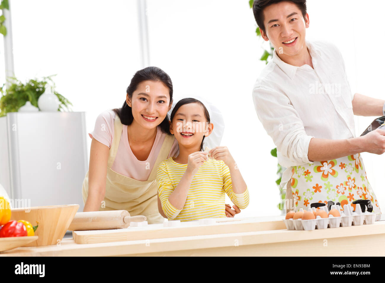 Family preparing food in kitchen Stock Photo - Alamy