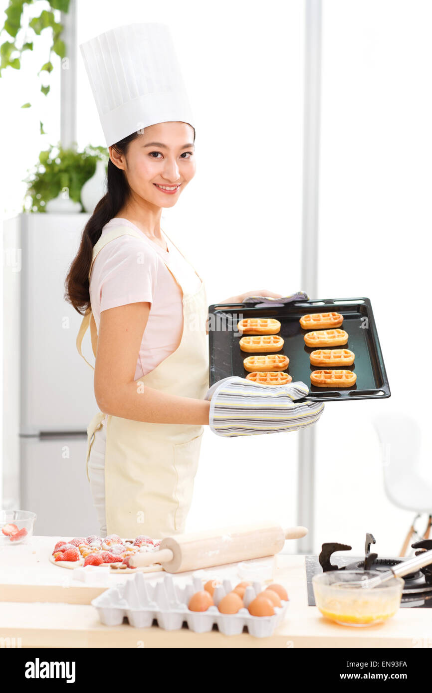 Woman baking at home Stock Photo - Alamy