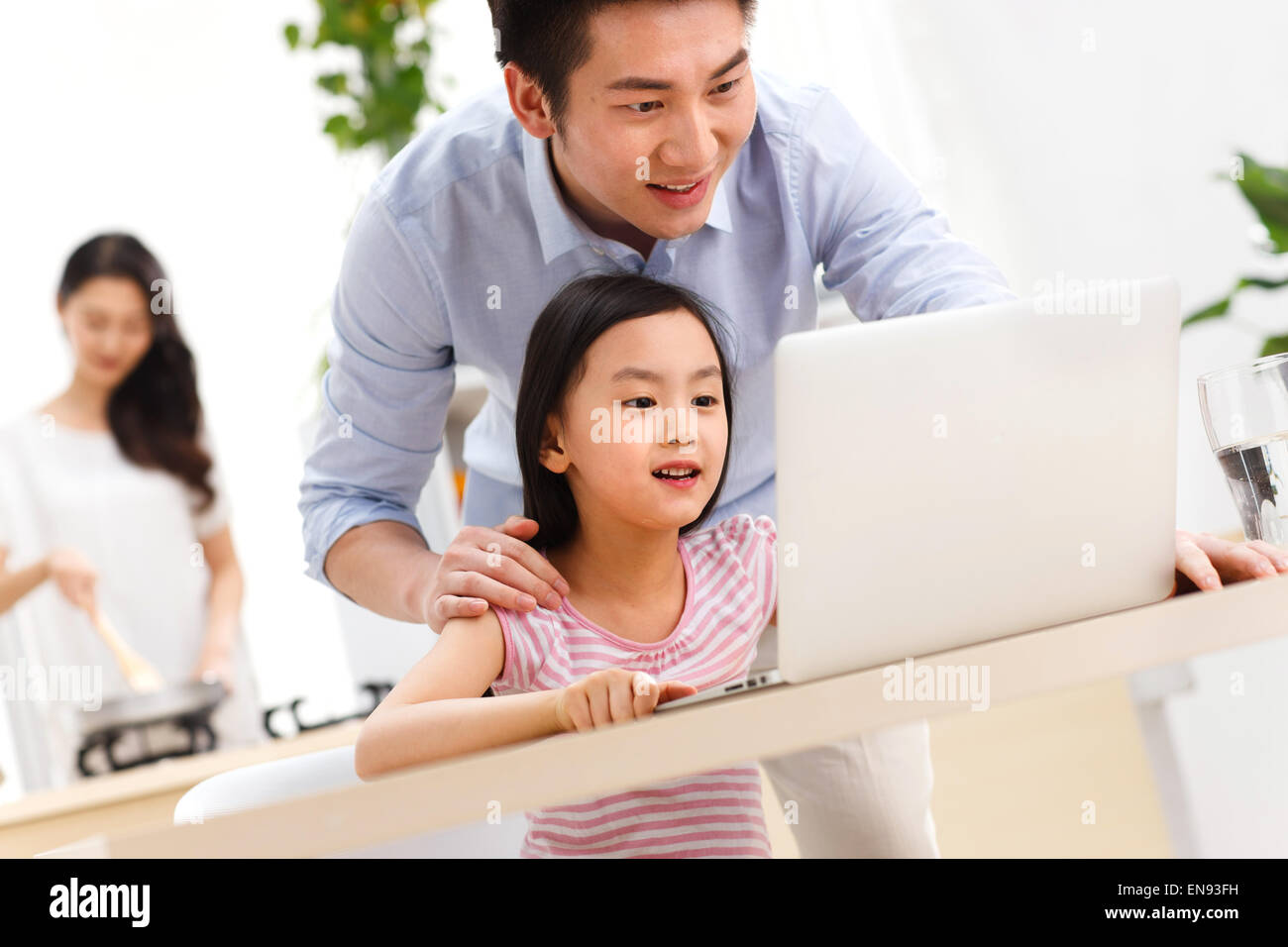 Family at home Stock Photo - Alamy