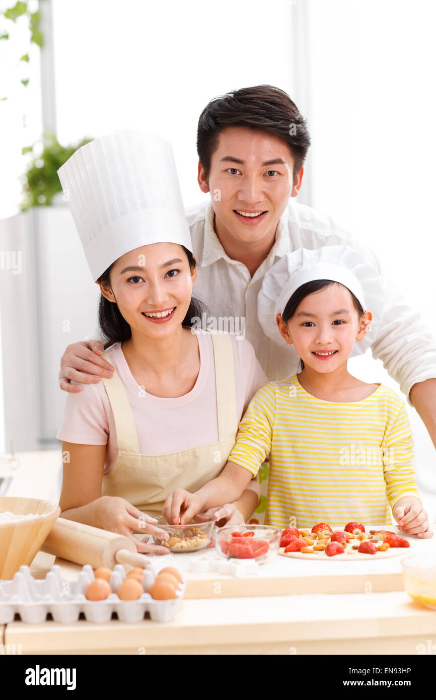 Family preparing food in kitchen Stock Photo - Alamy