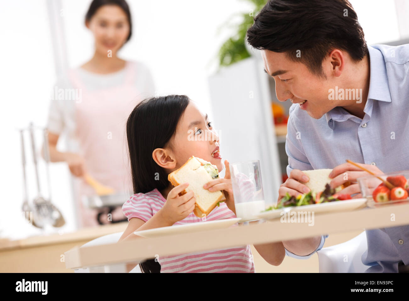 Family having breakfast at home Stock Photo - Alamy