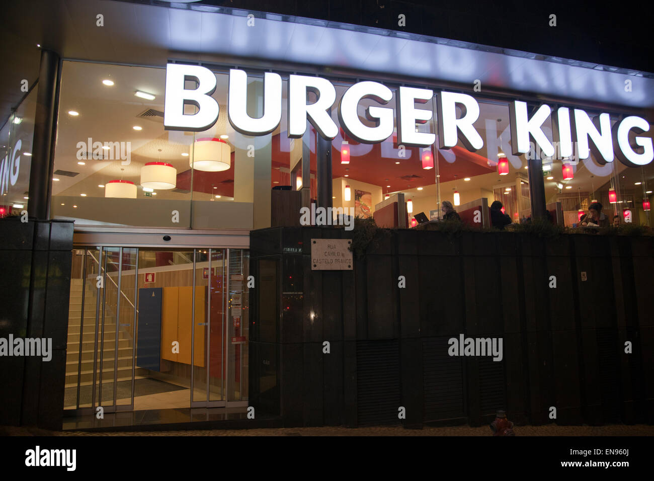 Burger King with Diners at Nighttime in Lisbon - Portugal Stock Photo ...