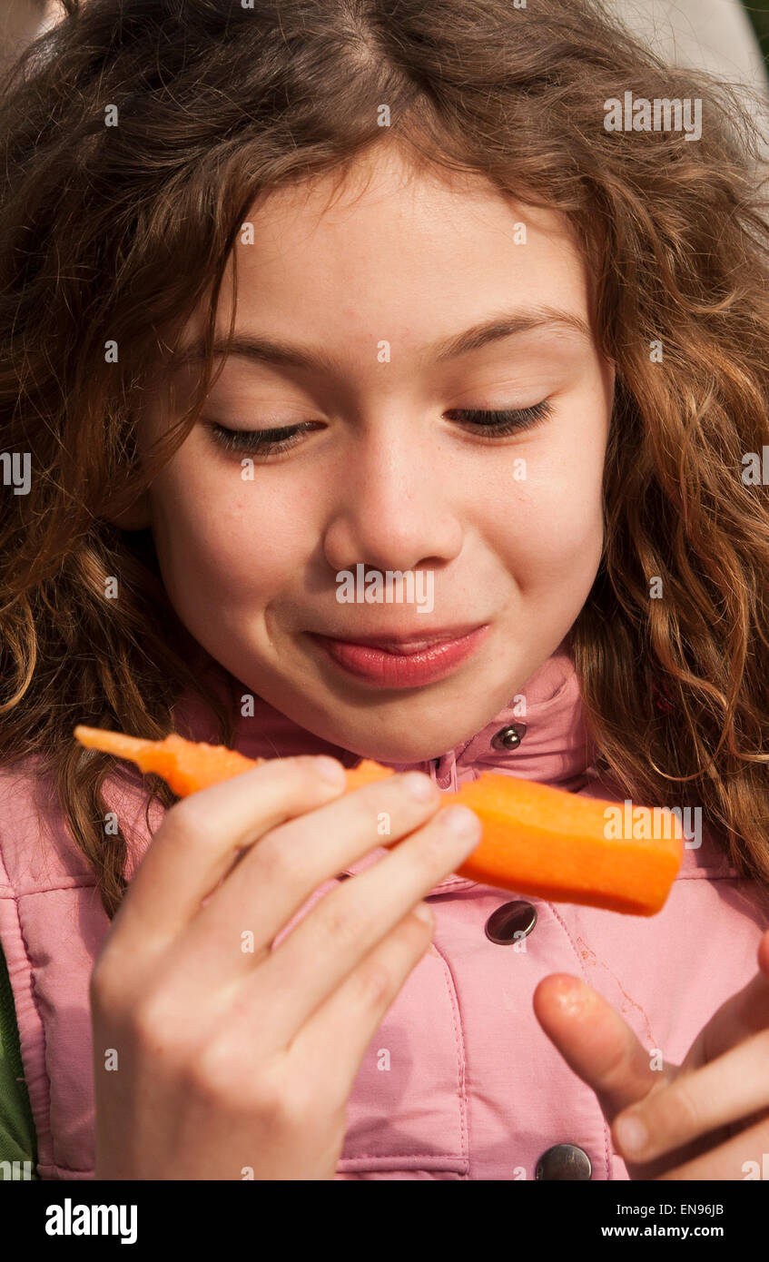 young child eating a fresh carrot Stock Photo - Alamy