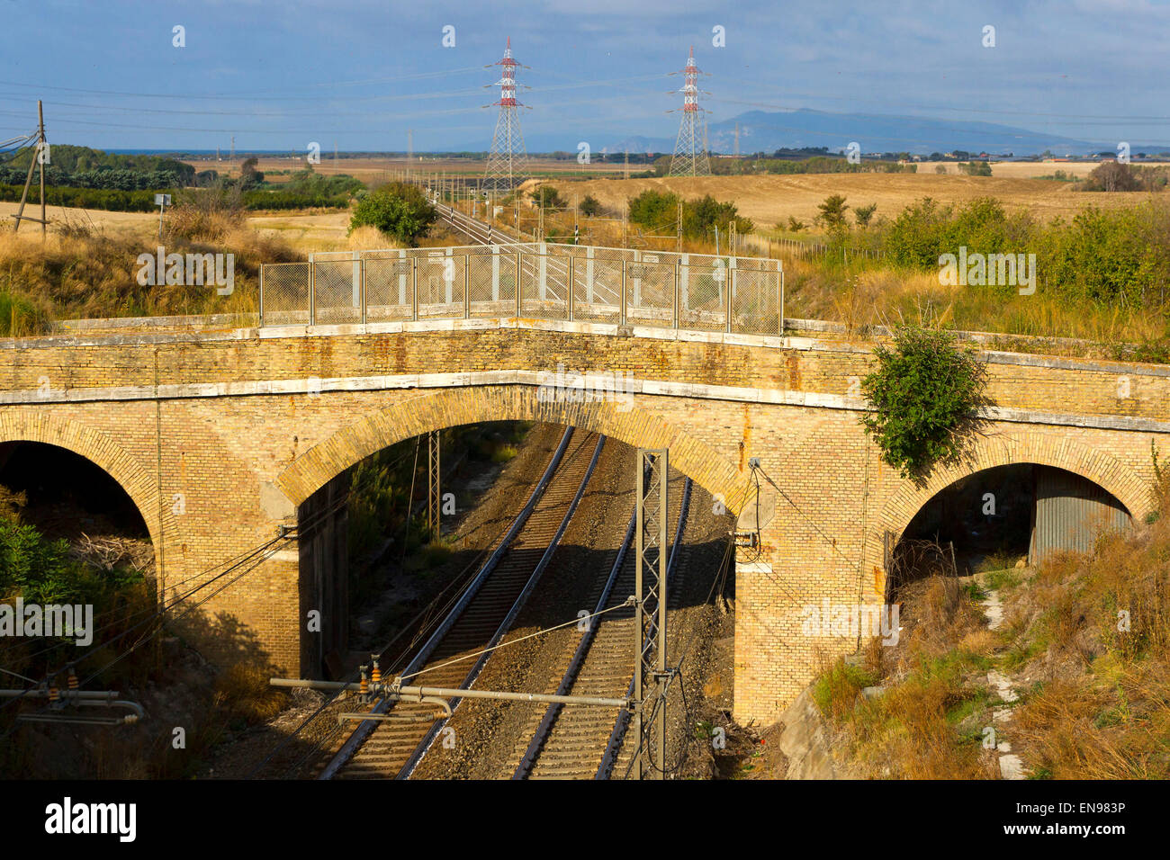 Railway line under bridge, Tuscany Italy Stock Photo - Alamy
