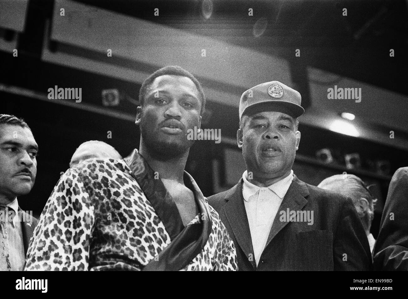 World Champion Joe Frazier (left) seen here with former World Champion ...