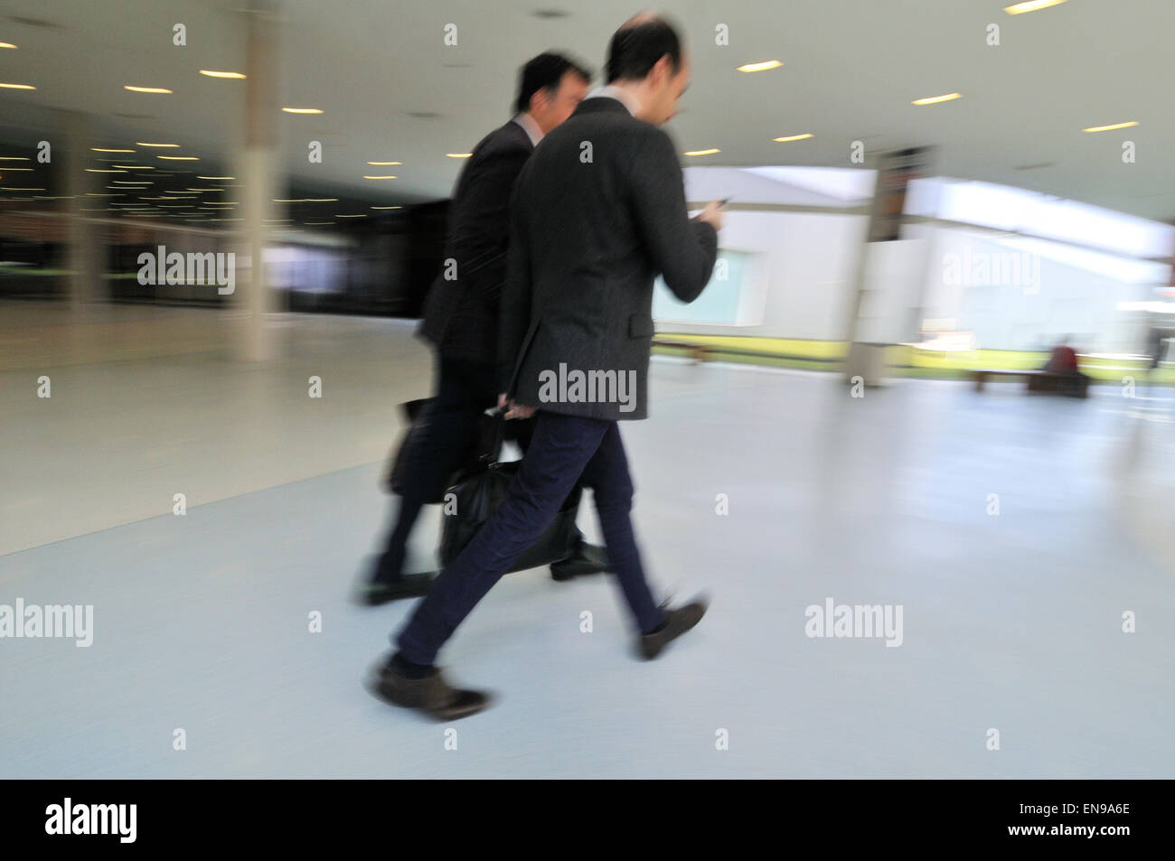 Business men in movement Stock Photo - Alamy