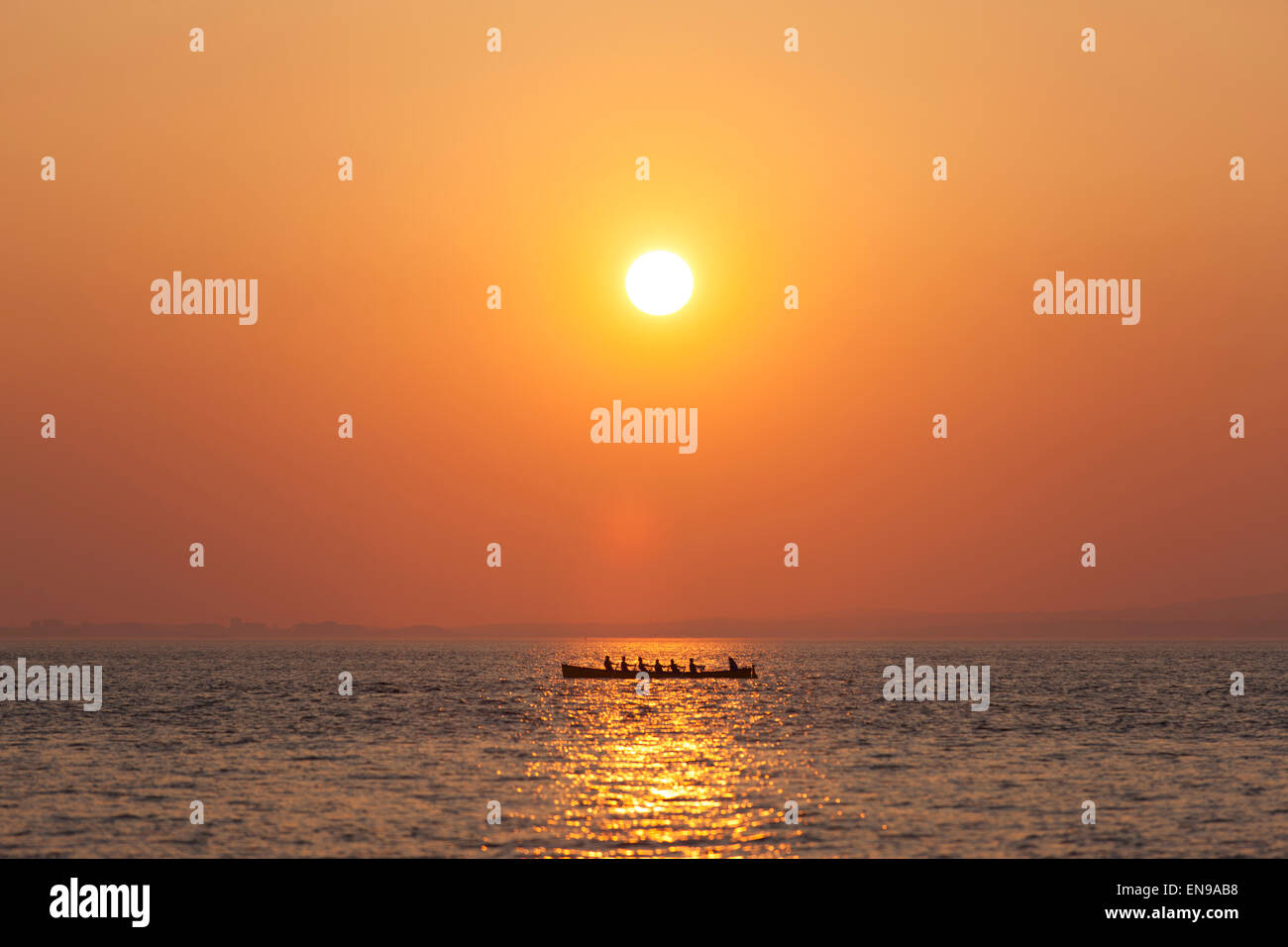 Clevedon Pilot Gig Club at sunset in the Bristol Channel Stock Photo ...