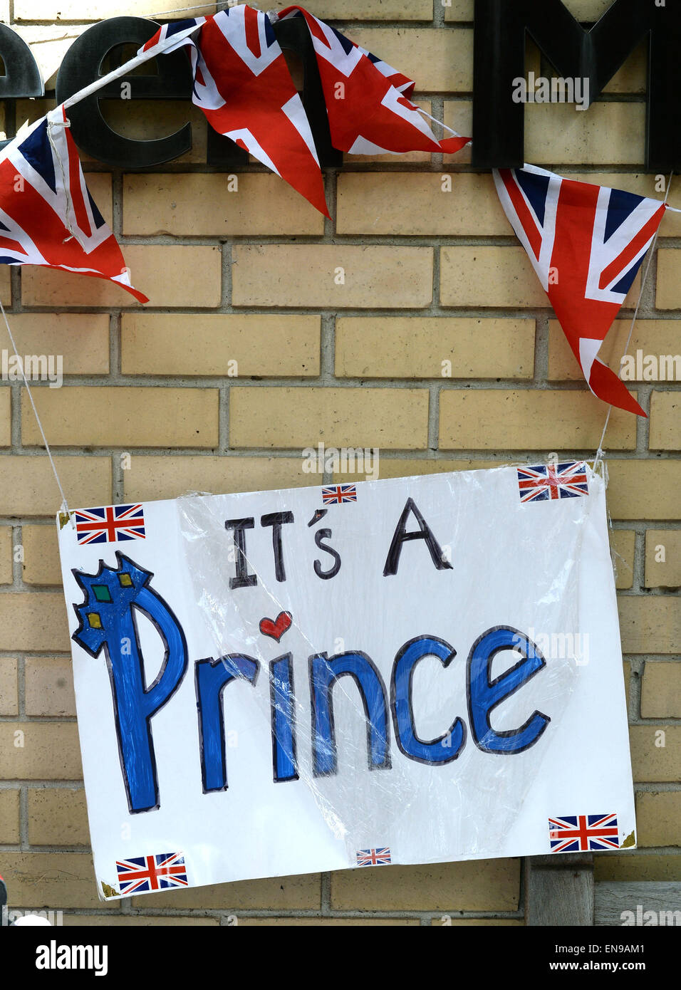 London, UK. 30th Apr, 2015. A sign written with 'It's a Prince' can be ...