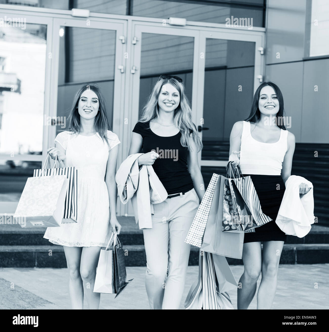 Young women after shopping Stock Photo - Alamy