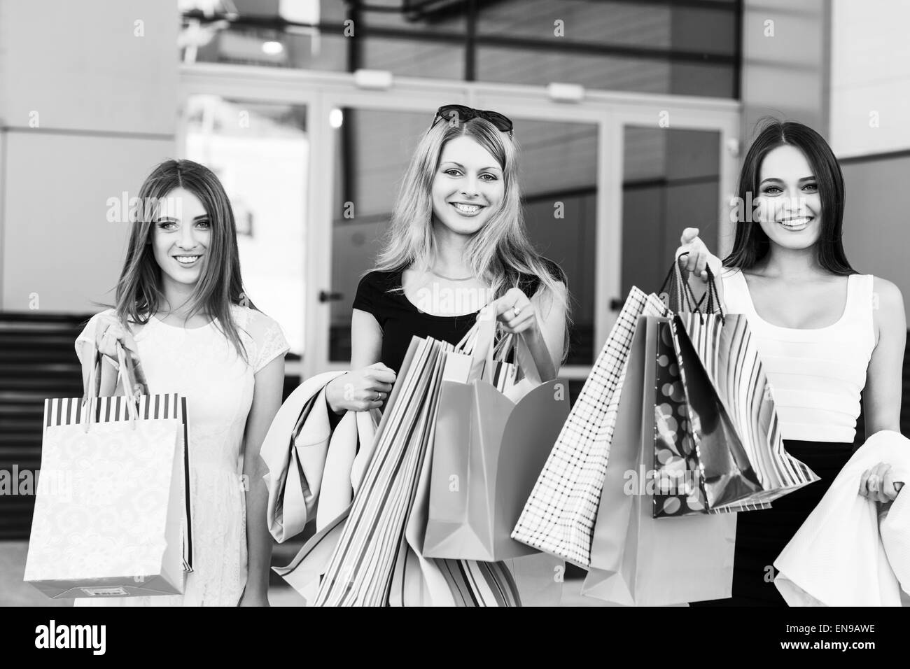 Young women after shopping Stock Photo - Alamy