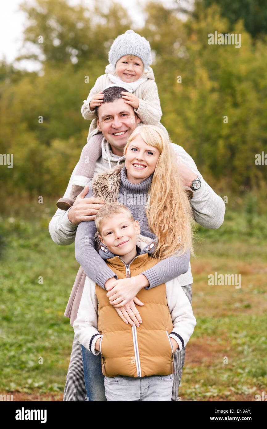 Family in the autumn park Stock Photo - Alamy