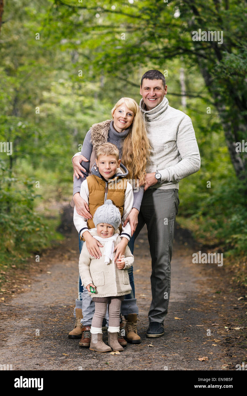 Family in the autumn park Stock Photo - Alamy