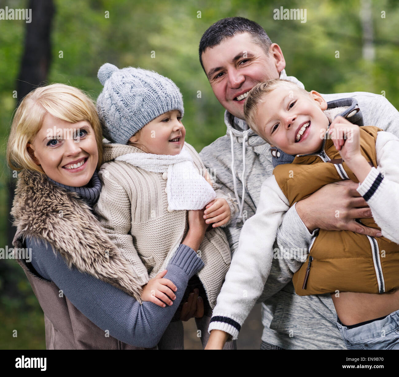 Family in the autumn park Stock Photo - Alamy