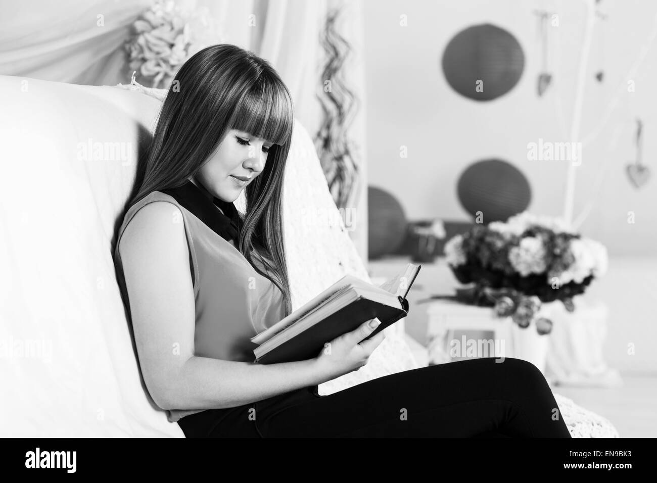 Beautiful little girl reading book Stock Photo - Alamy