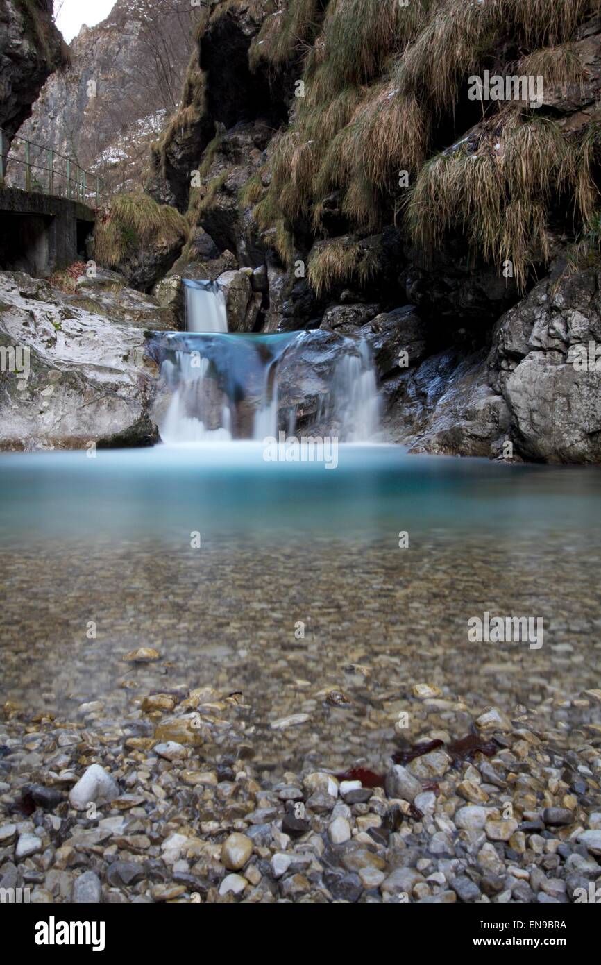 a view of a waterfall in a wood Stock Photo - Alamy