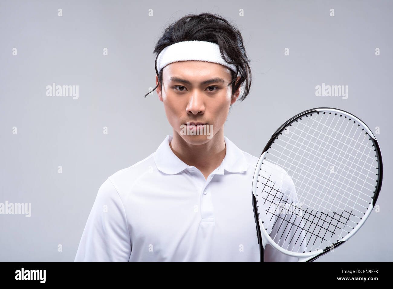 Young man holding tennis racquet, getting ready for a challenge Stock ...