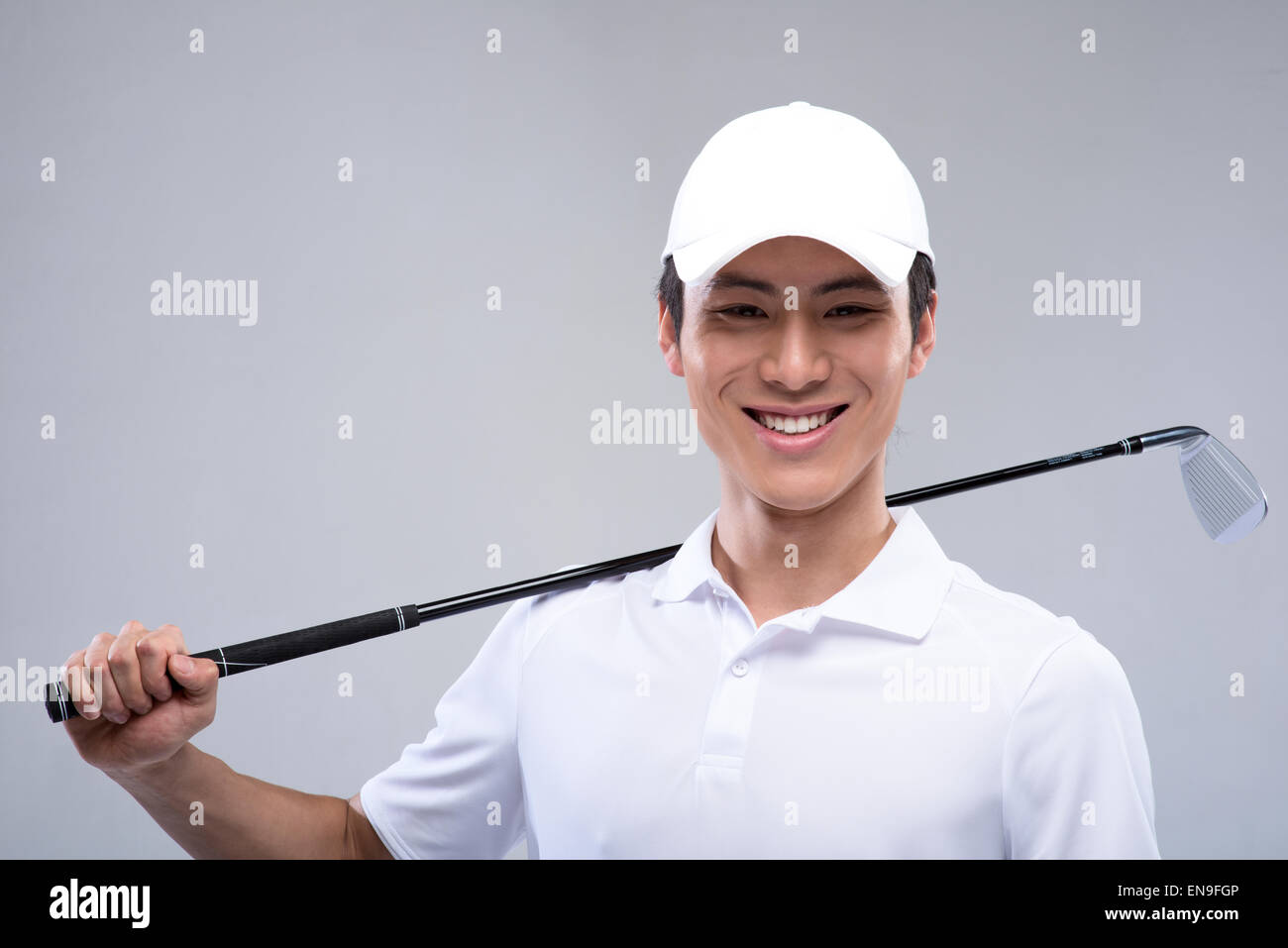 Young man playing golf Stock Photo - Alamy