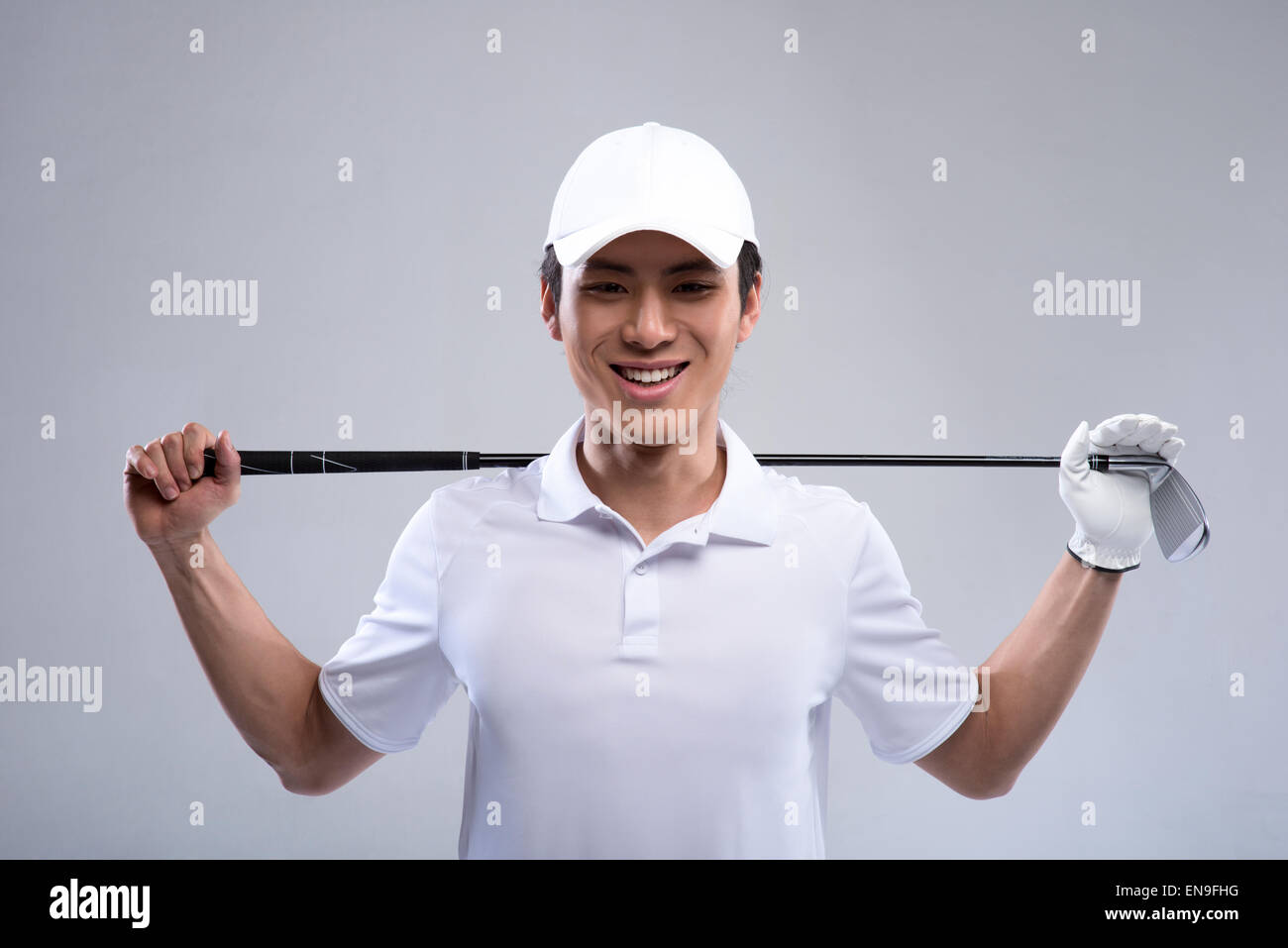 Young man playing golf Stock Photo - Alamy