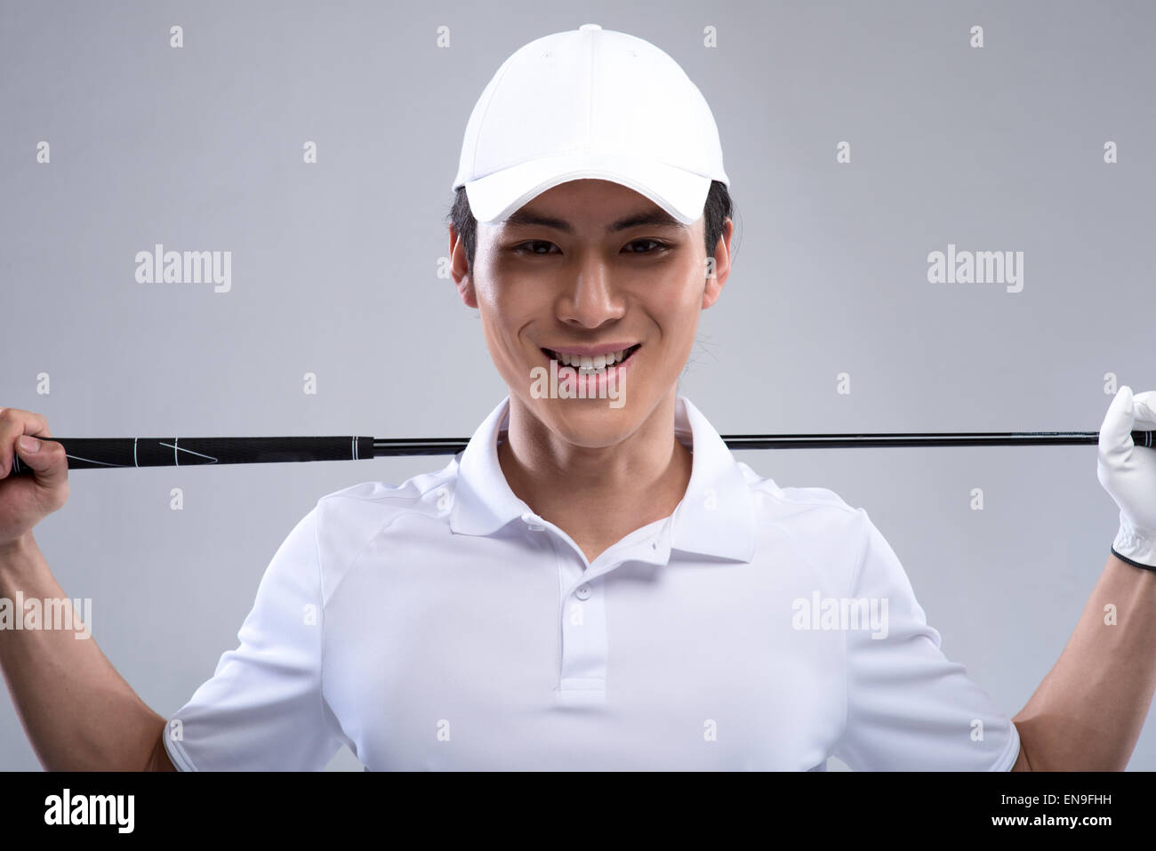 Young man playing golf Stock Photo - Alamy