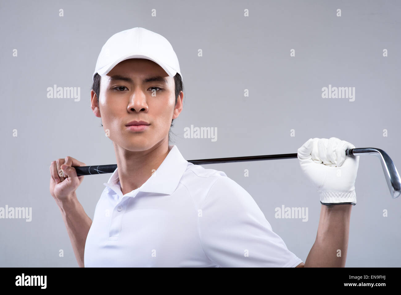 Young man playing golf Stock Photo - Alamy