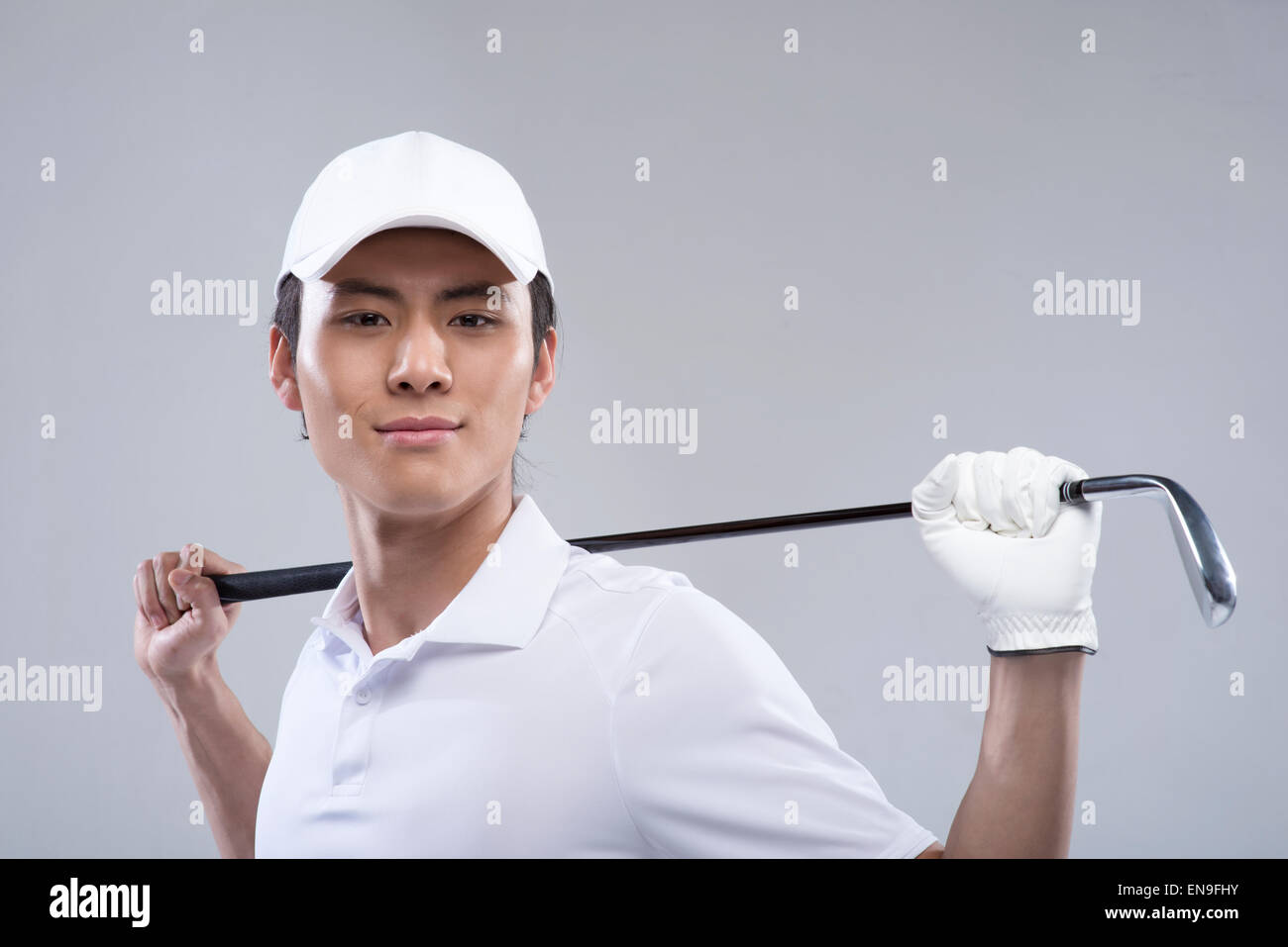 Young man playing golf Stock Photo - Alamy