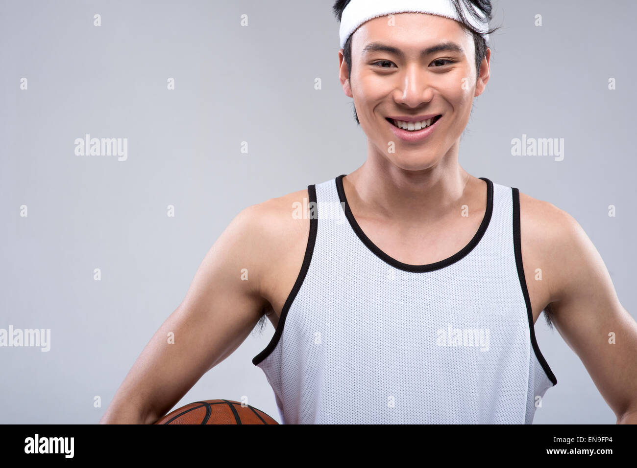 Young man holding basketball Stock Photo - Alamy Young man holding basketball Stock Photo - Alamy