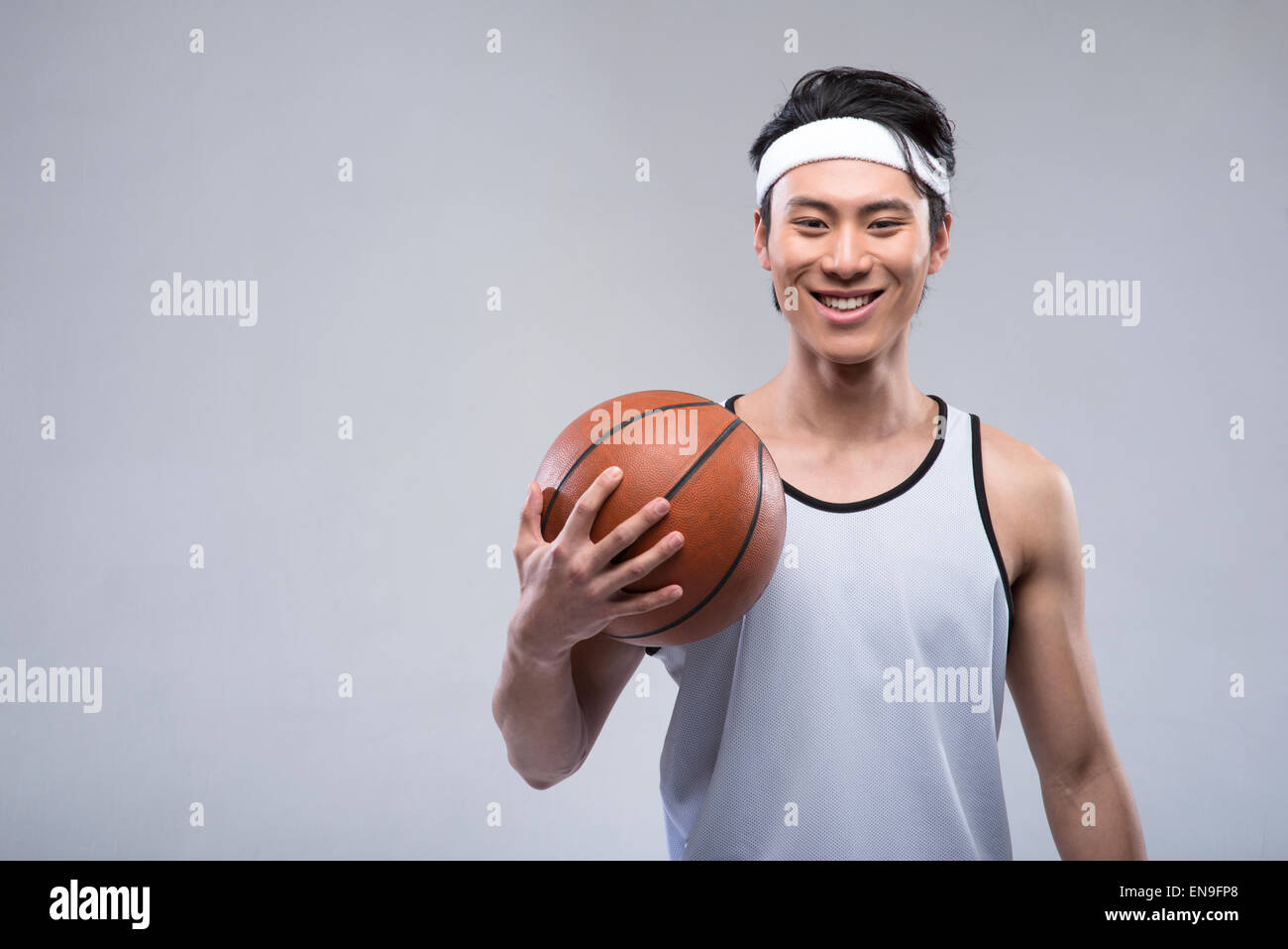 Young man holding basketball Stock Photo - Alamy Young man holding basketball Stock Photo - Alamy