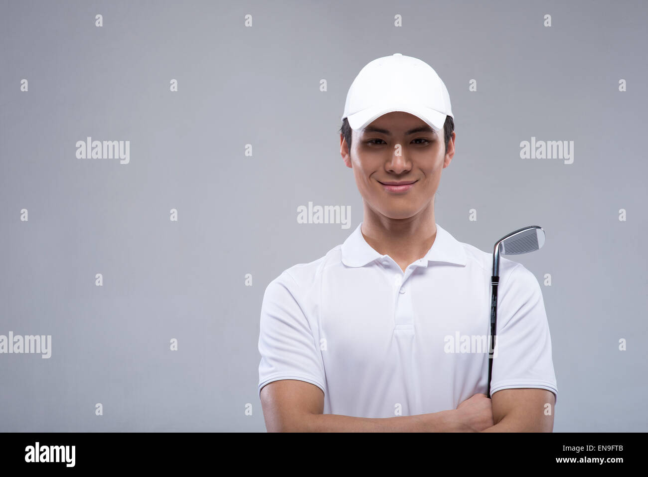 Young man relaxing by playing golf Stock Photo - Alamy
