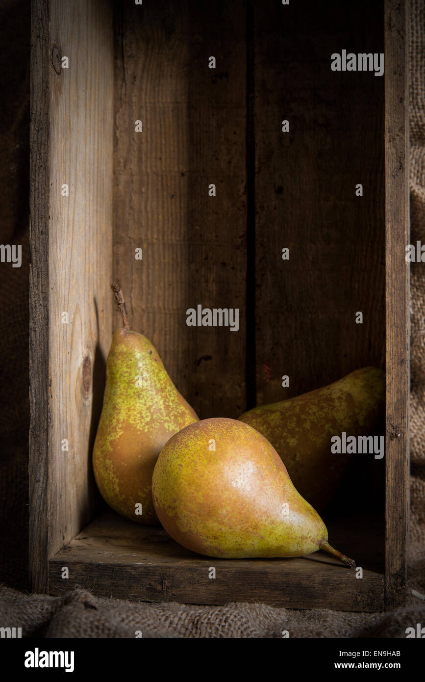 Pears in rustic setting with wooden box and hessian sack Stock Photo ...