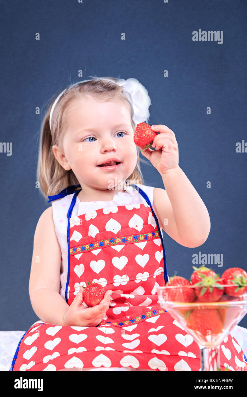 studio portrait of a little girl with strawberries Stock Photo - Alamy