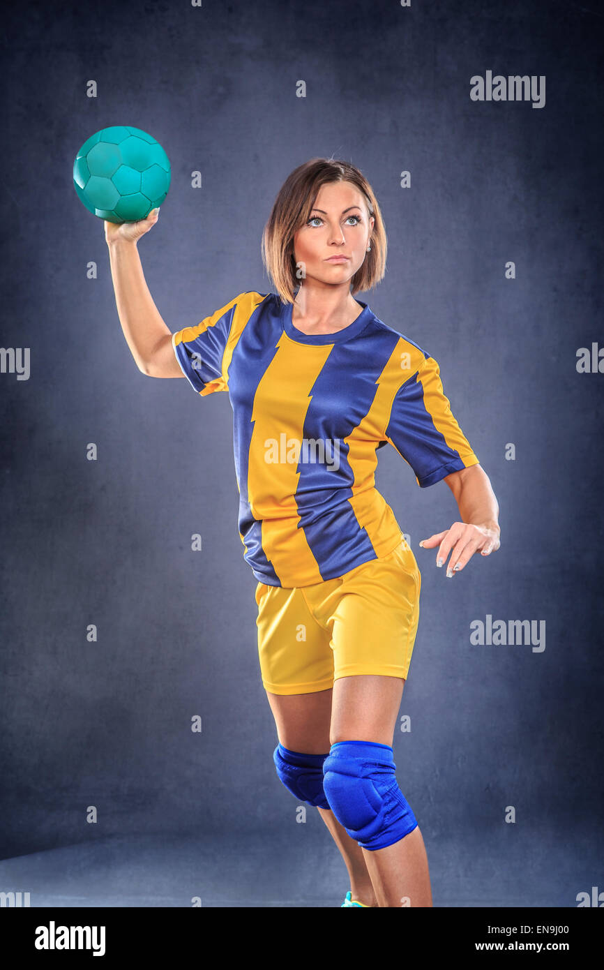 female handball player with a ball on the field Stock Photo - Alamy