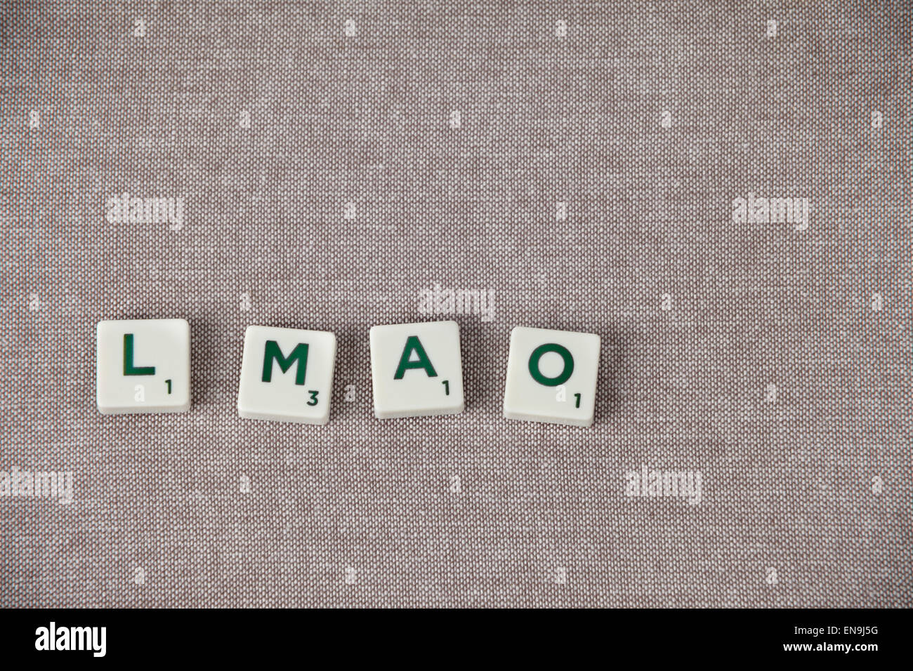 Scrabble letters spelling LMAO Stock Photo - Alamy