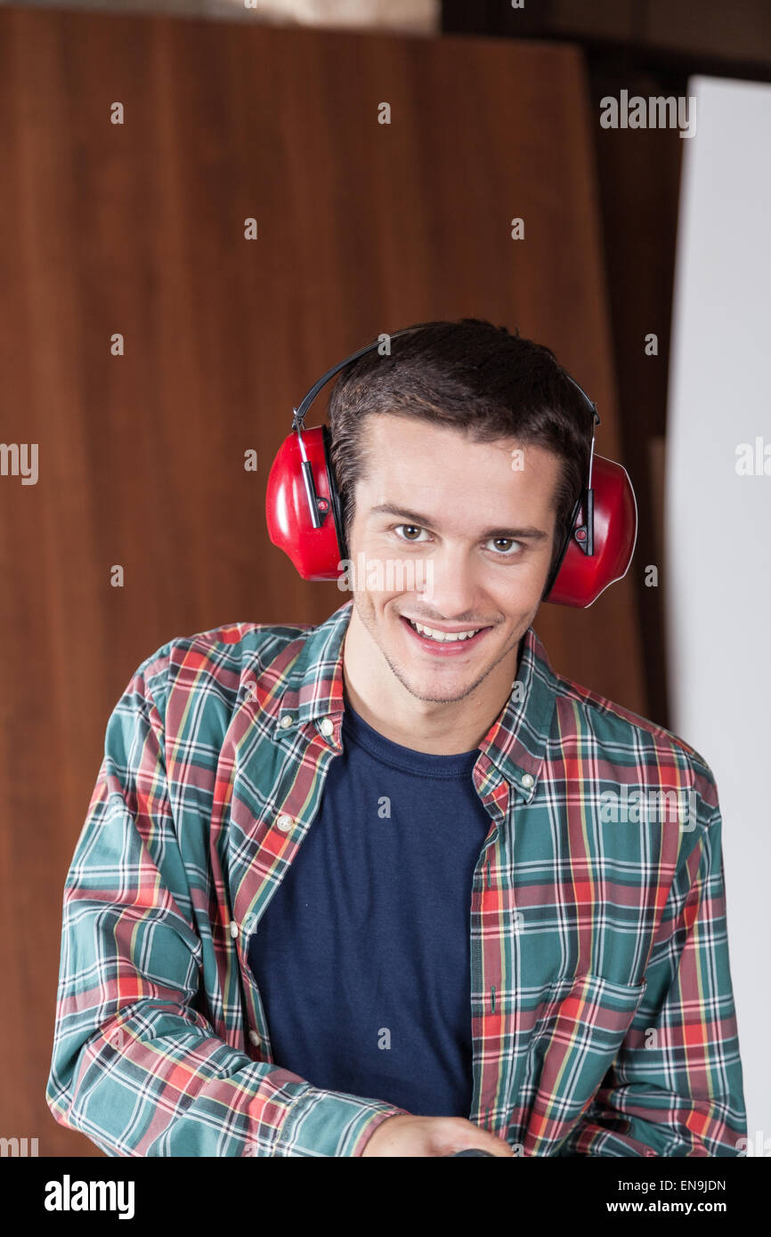 Carpenter cutting wood Stock Photo - Alamy