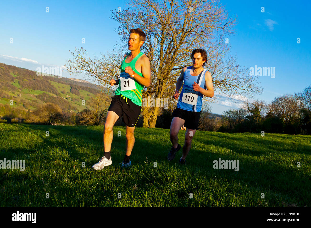 Fell racers cross country running across a hillside near Matlock Bath ...