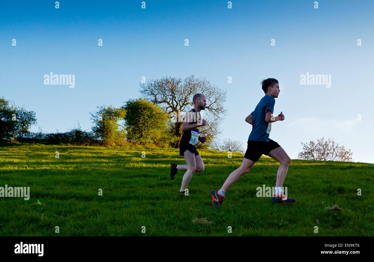 Fell racers cross country running across a hillside near Matlock Bath ...