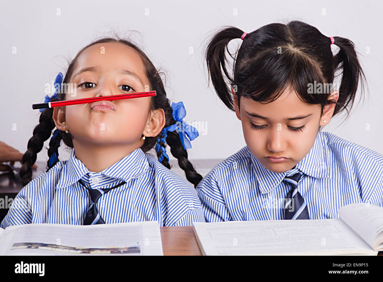 2 indian kids friends Classroom fun Stock Photo - Alamy