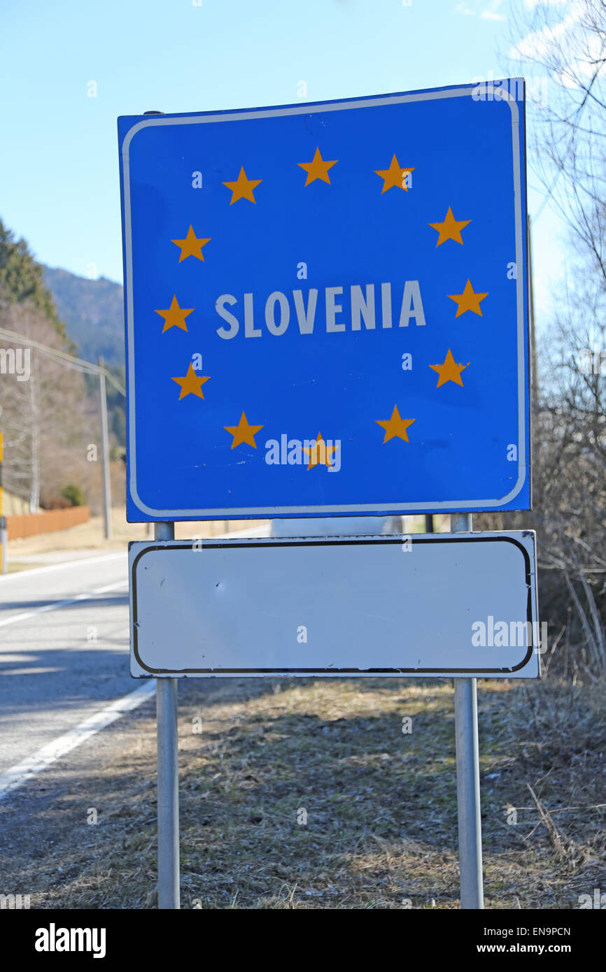 blue road sign with yellow stars in the border area between slovenia ...