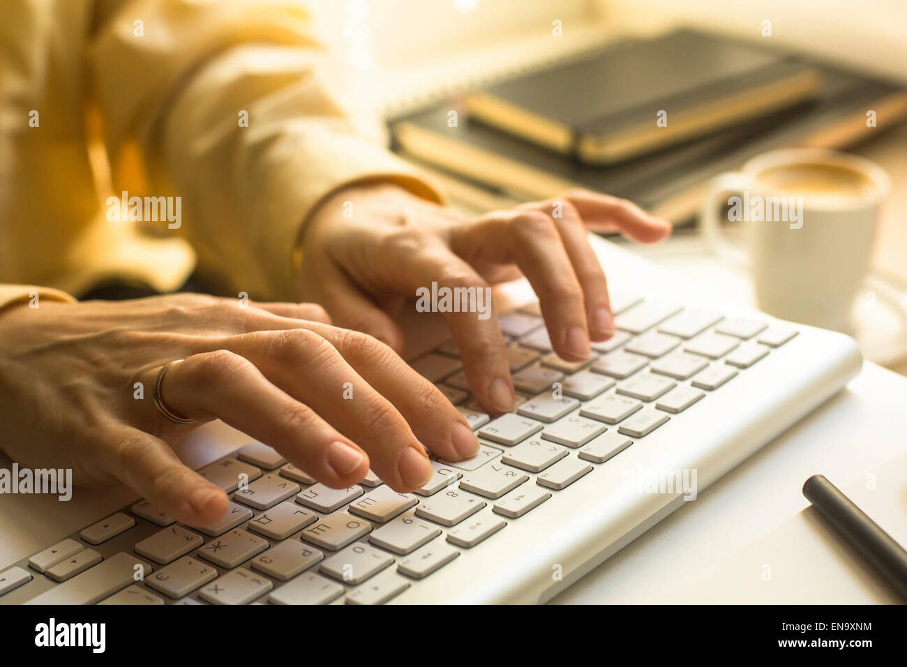 Worker typing hi-res stock photography and images - Alamy