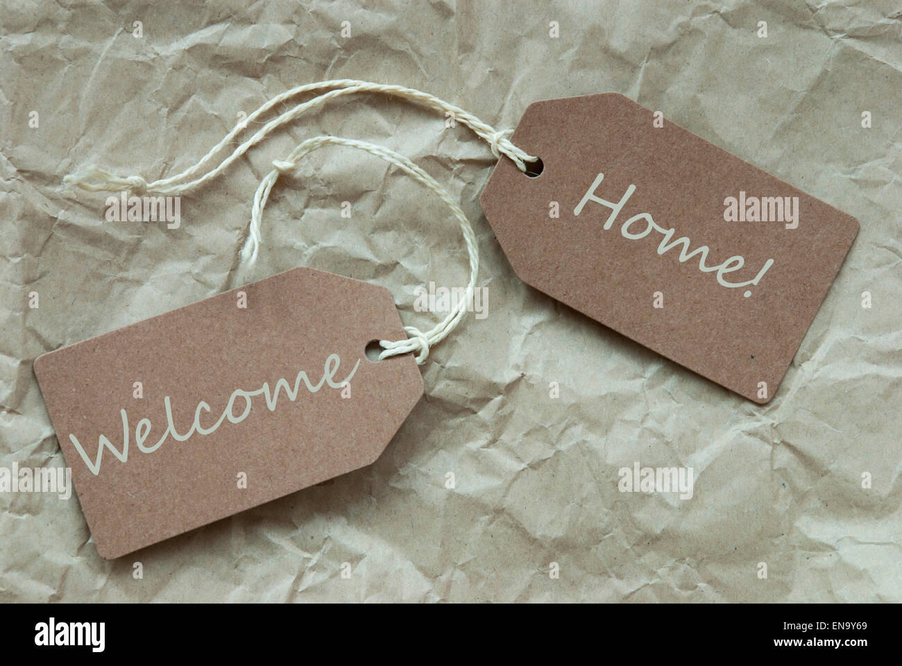 Beige Labels With Welcome Home Paper Background Stock Photo - Alamy