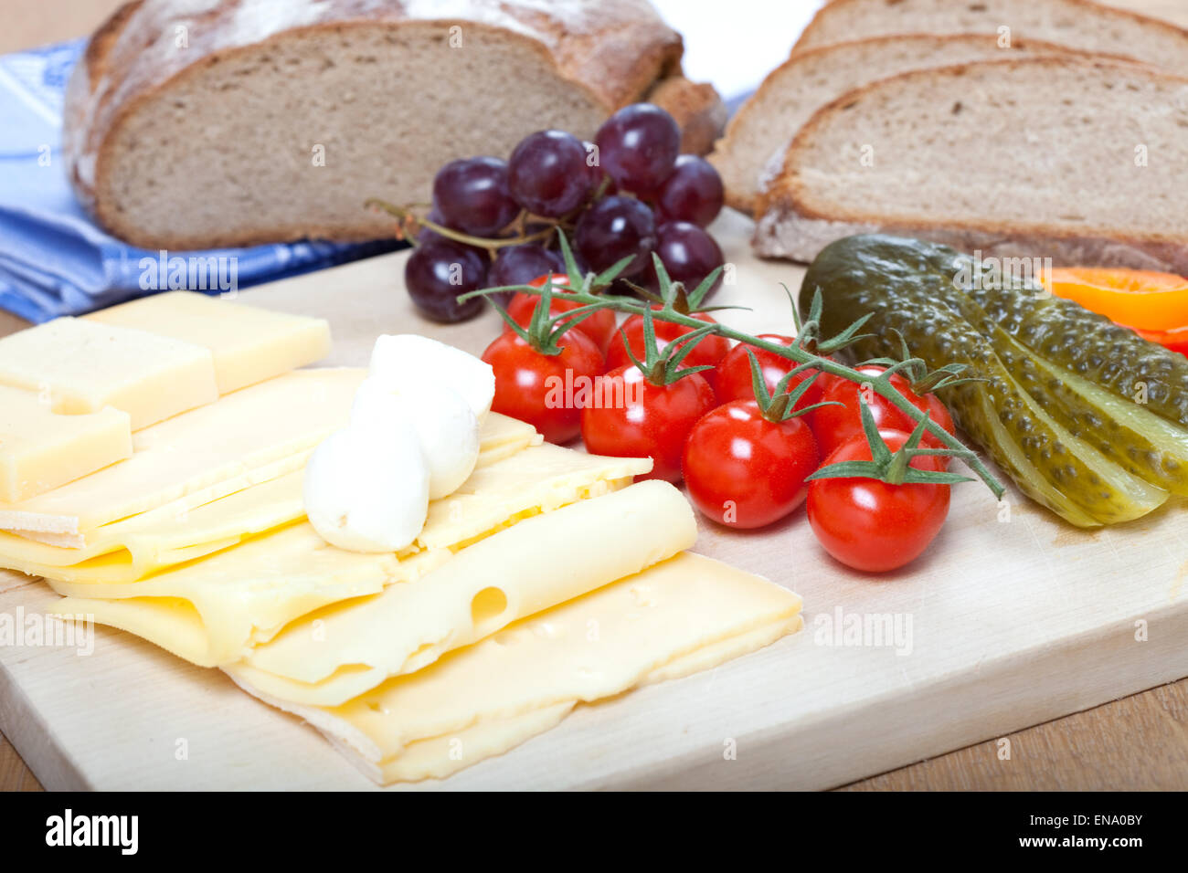 traditional light meal with german bread, cheese, vegetables and fuits ...