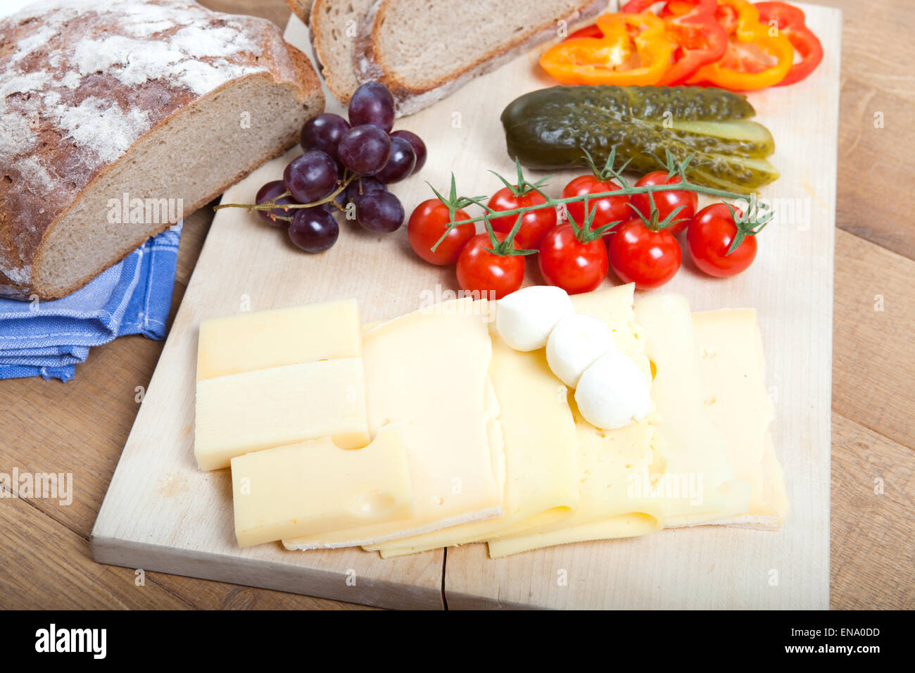traditional bavarian light meal on rustic wooden board with german ...