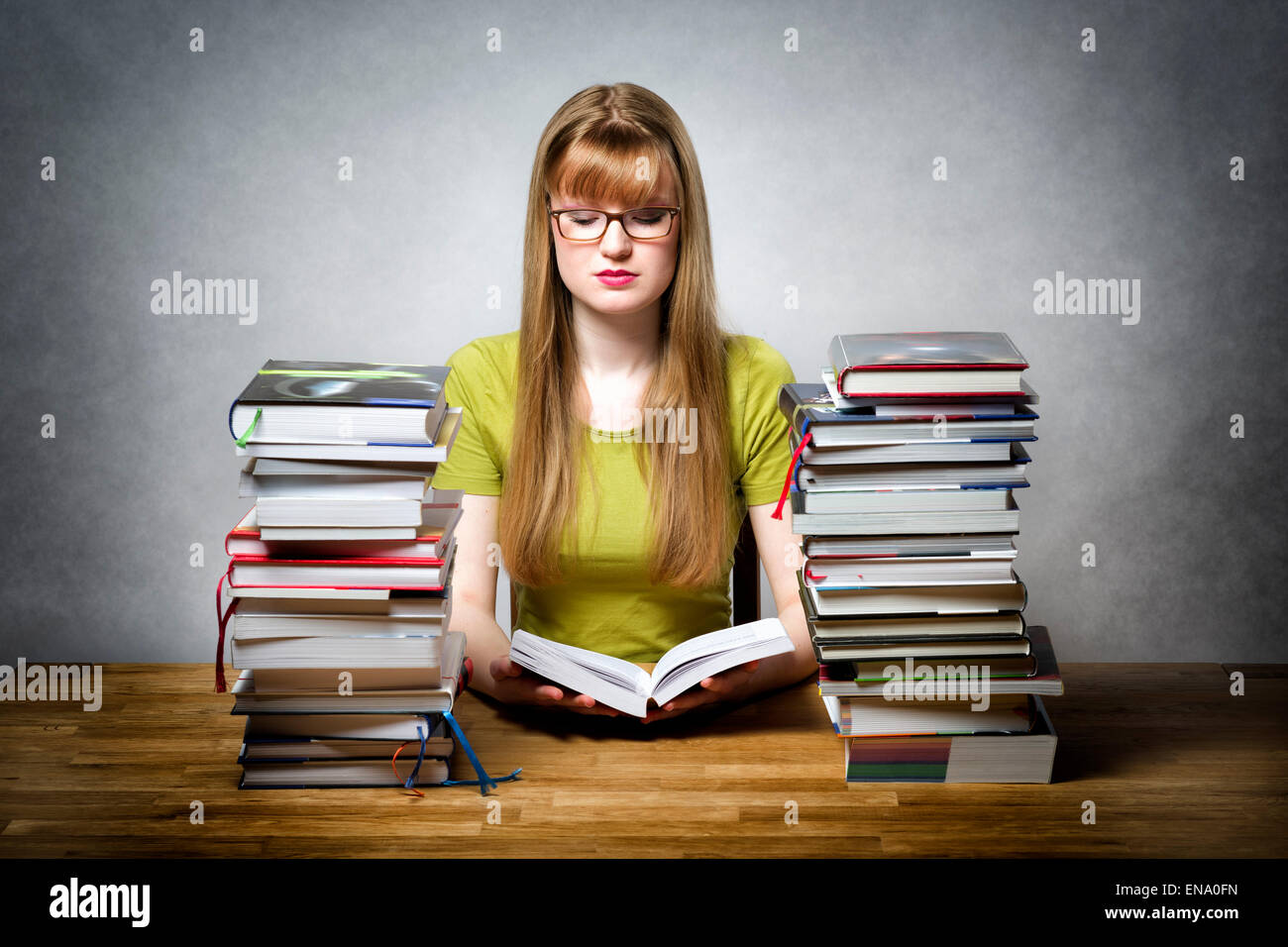 Teen girl student bored table reading hi-res stock photography and ...