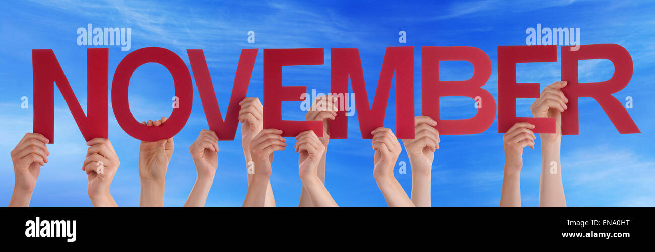 Hands Holding Red Straight Word November Blue Sky Stock Photo - Alamy