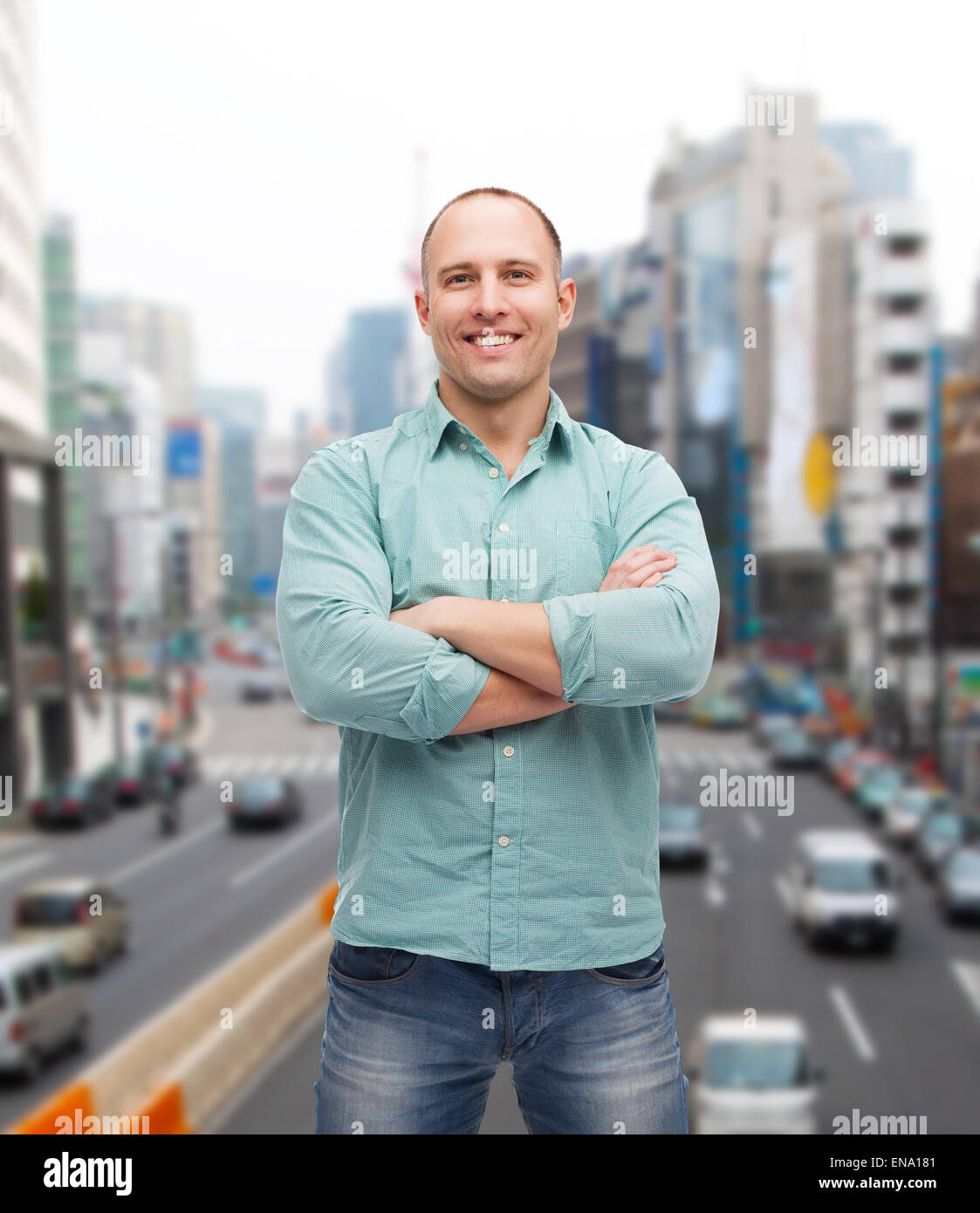 smiling man with crossed arms Stock Photo - Alamy