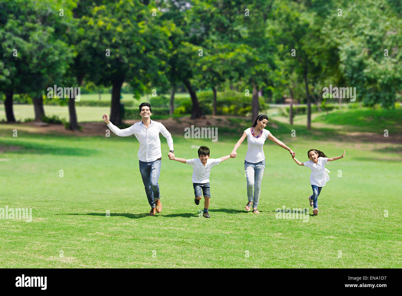 indian Parents and kids park Running Stock Photo - Alamy