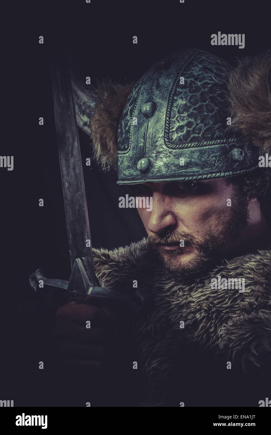 Costume, Viking warrior with a huge sword and helmet with horns Stock ...